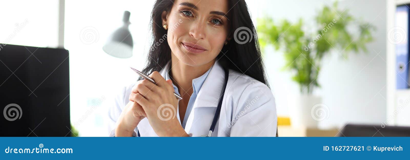Female GP Sitting at Worktable in Office Stock Image - Image of ...