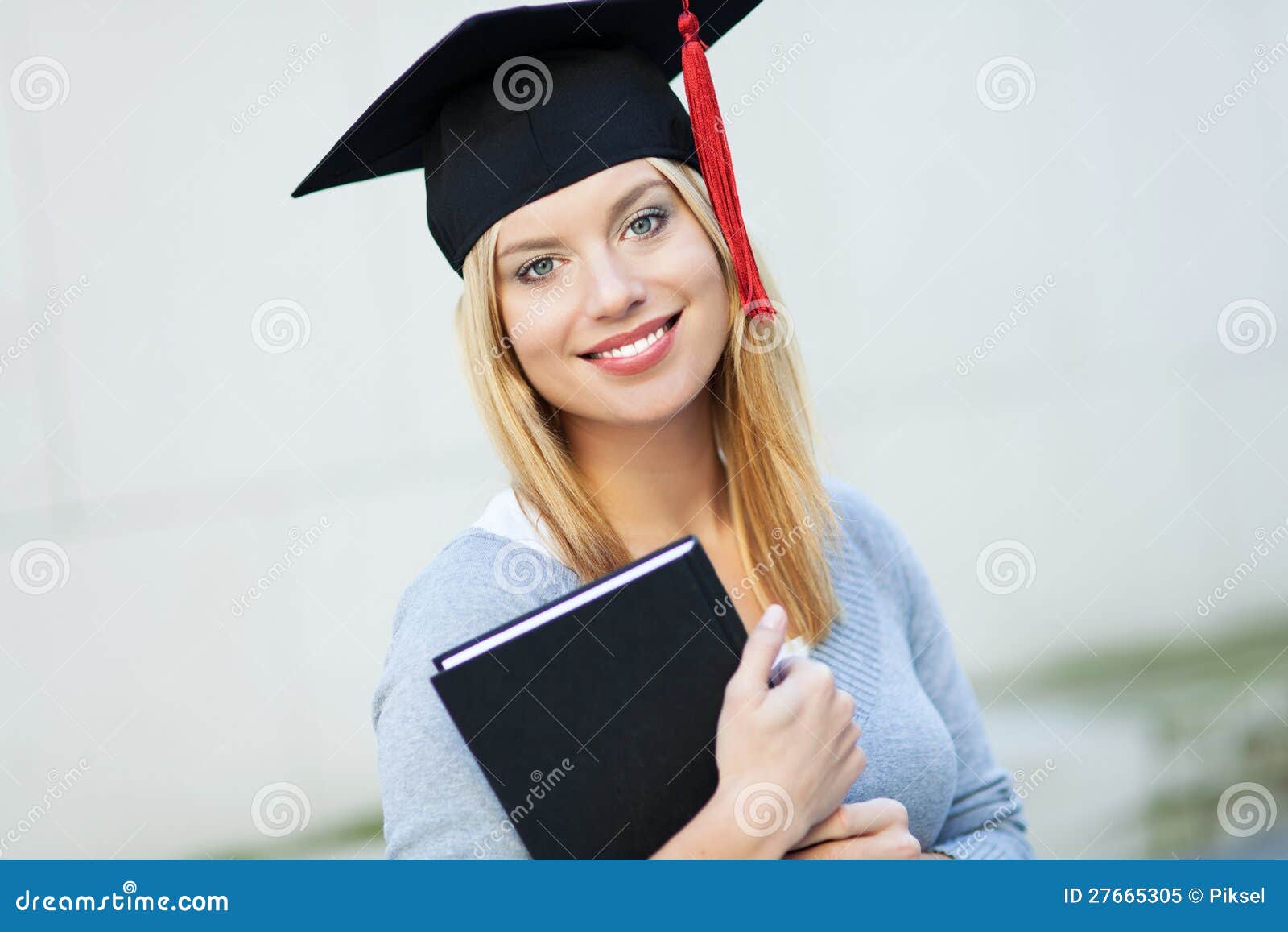 Female Graduate Holding Book Stock Image - Image of attractive, adult ...