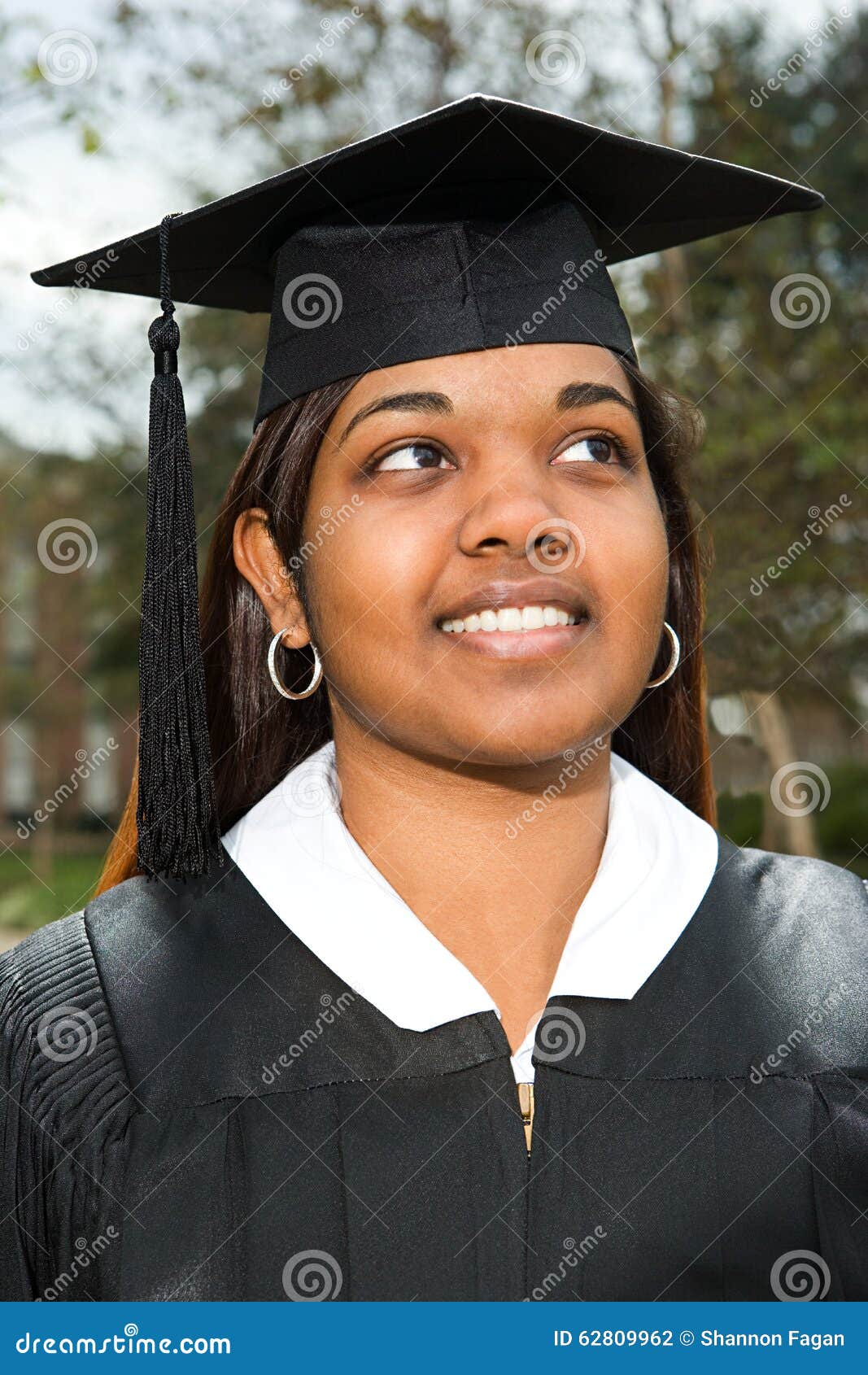 Female graduate looking up stock photo. Image of bachelor - 62809962