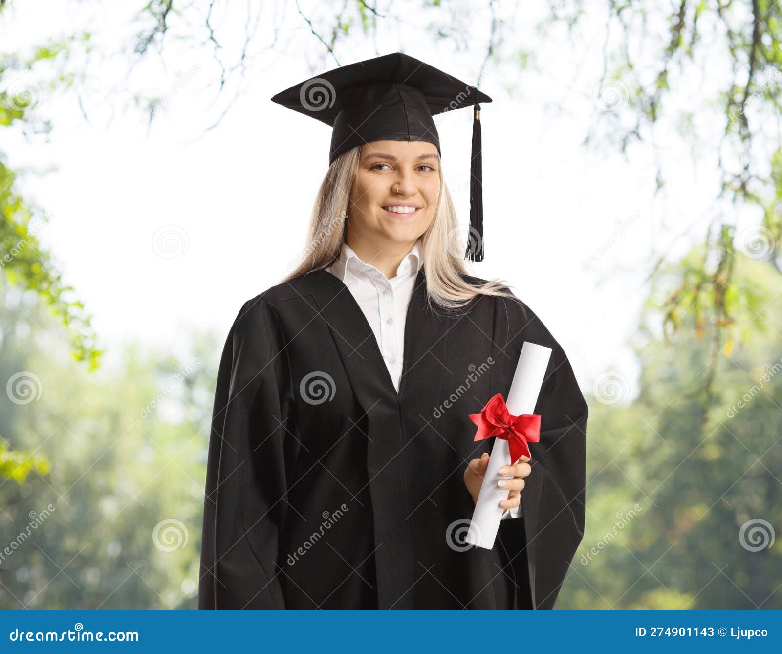 Female Graduate Student Holding a Bachelor Certificate Outdoors with ...