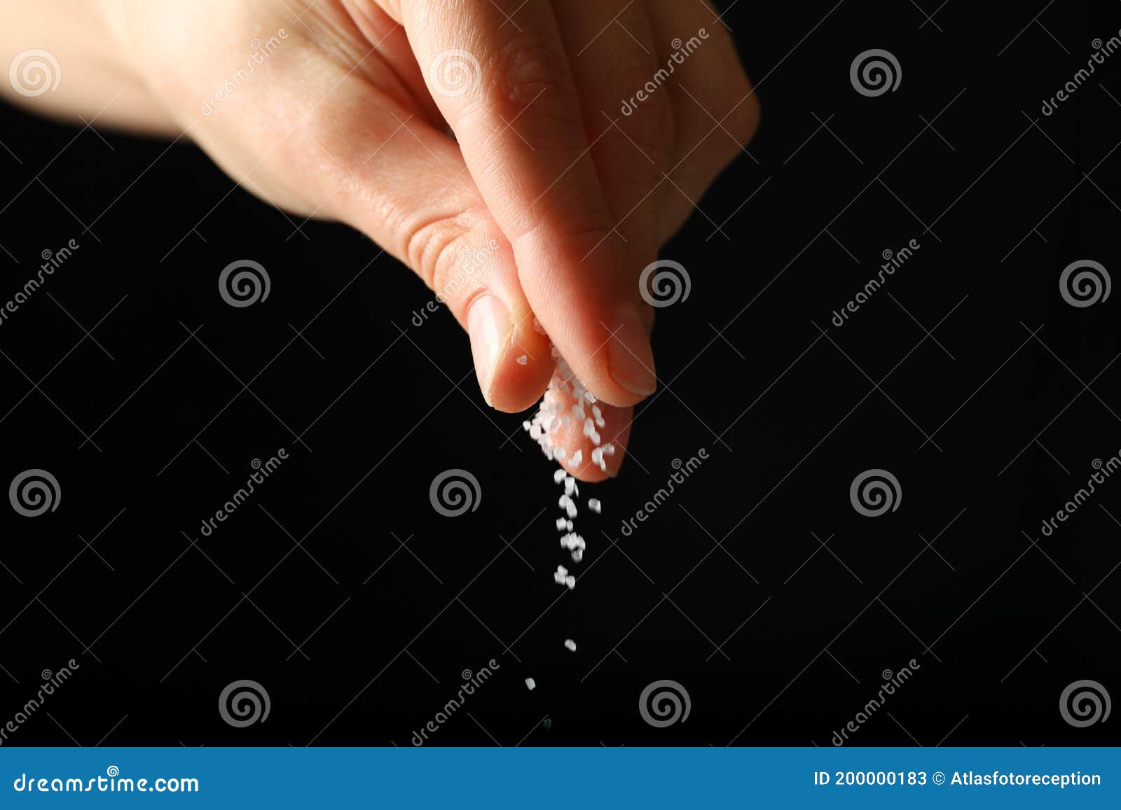 Female Hand Adding Salt On Black Background Royalty-Free Stock ...