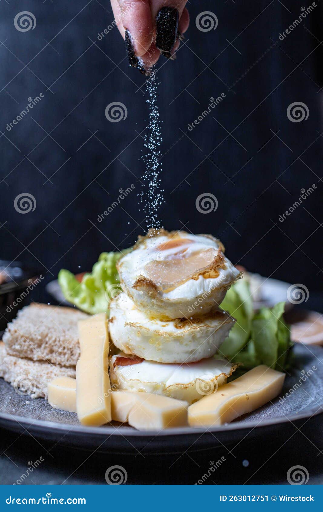 Female Hand Adding Salt To the Egg Breakfast Stock Image - Image of ...