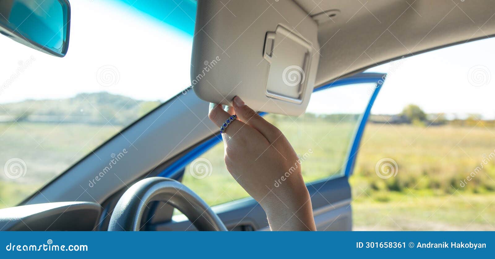 Female Hand Adjusting Sun Visor in a Car Stock Image - Image of female ...