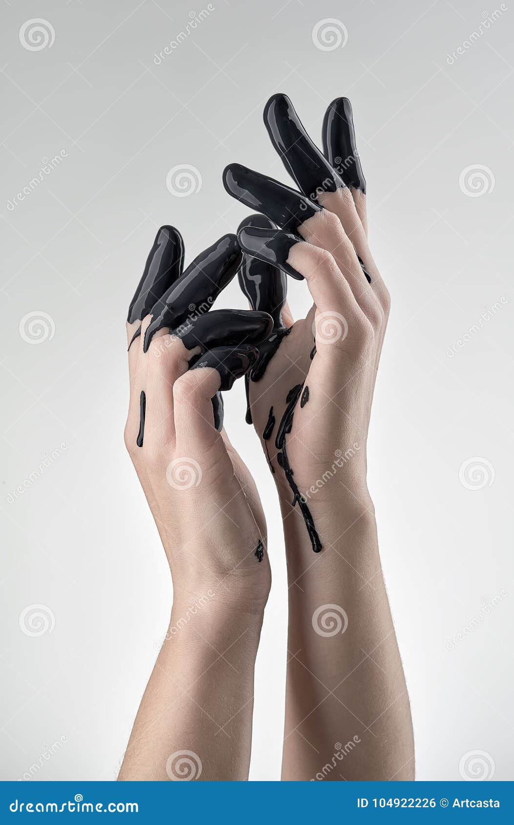 Female hand in black oil stock photo. Image of abstraction - 104922226