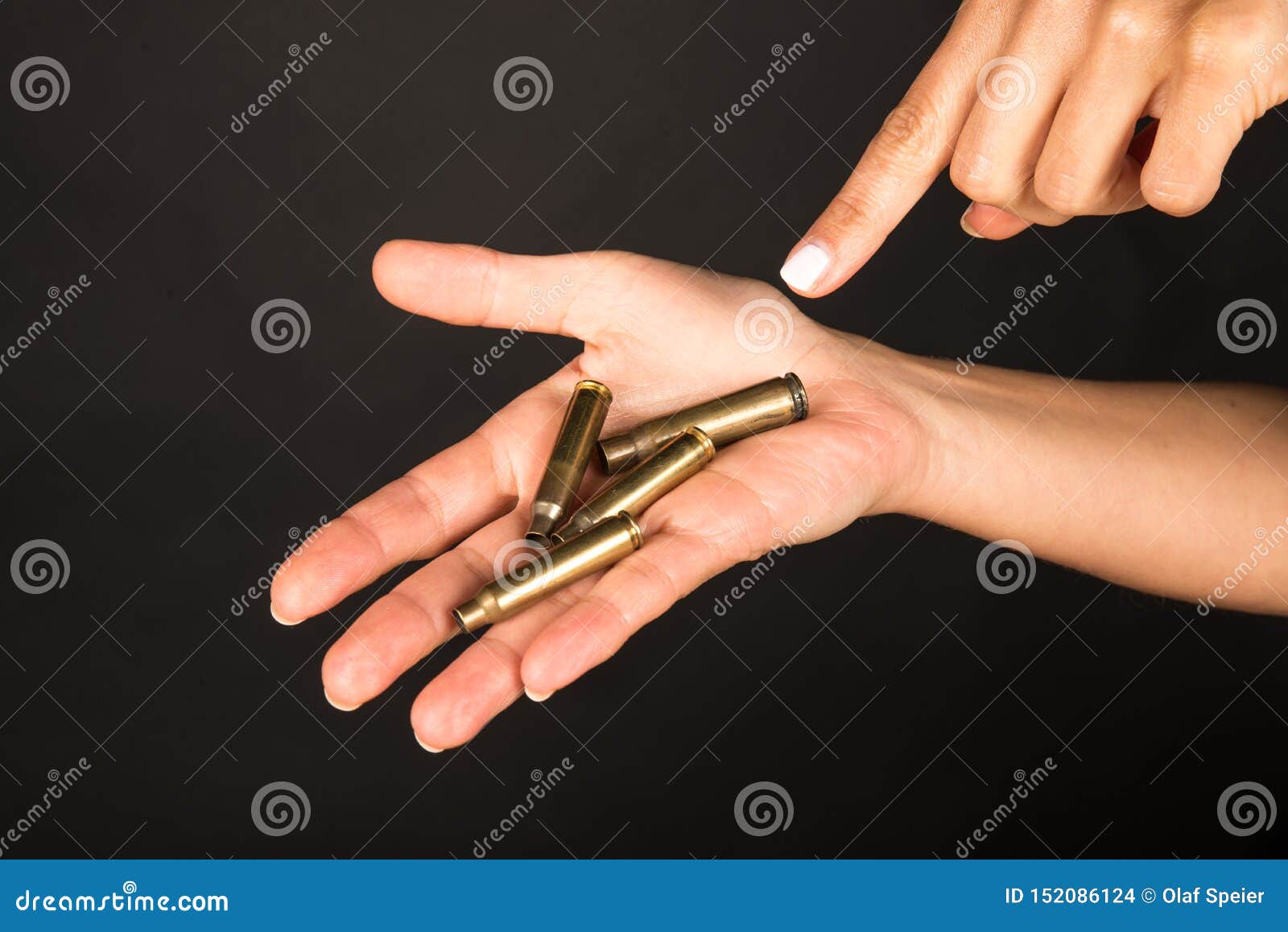 Female hand with bullets stock photo. Image of studio - 152086124