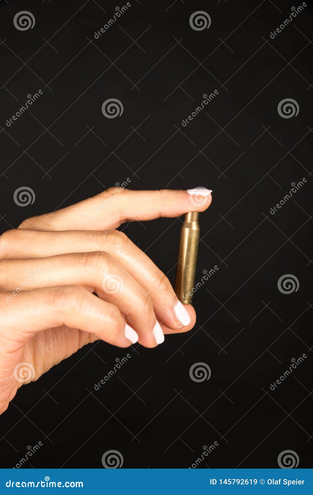Female hand with bullets stock image. Image of shooting - 145792619