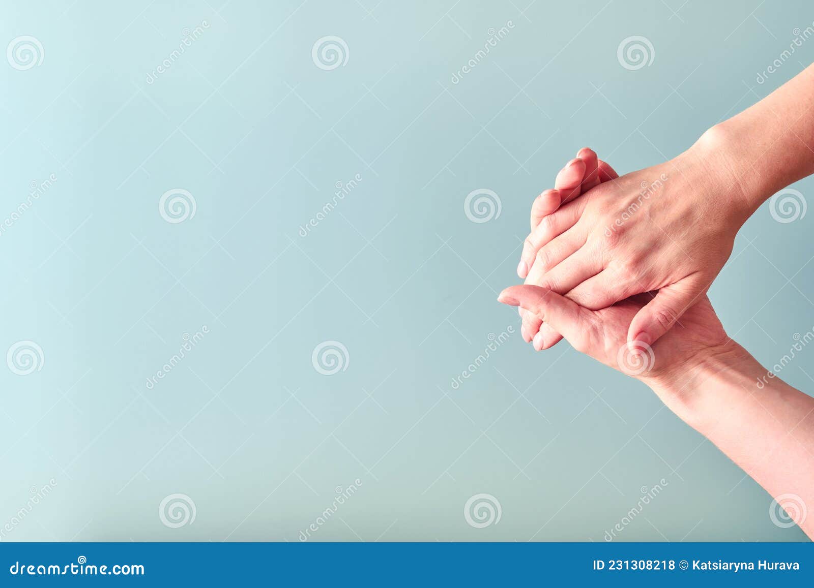 Female Hand Handshake Sign on Light Blue Background. Selective Focus ...