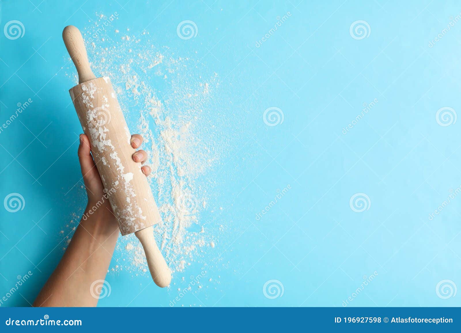 Female Hand Hold Rolling Pin on Blue Background Stock Photo - Image of ...