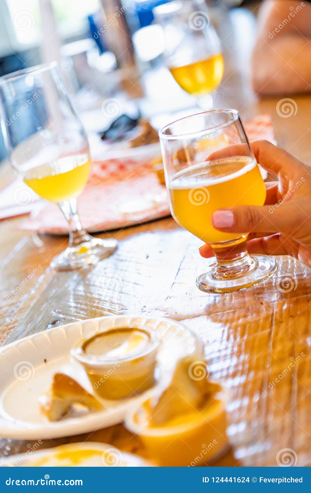 Female Hand Holding Glass of Micro Brew Beer at Bar Stock Photo - Image ...