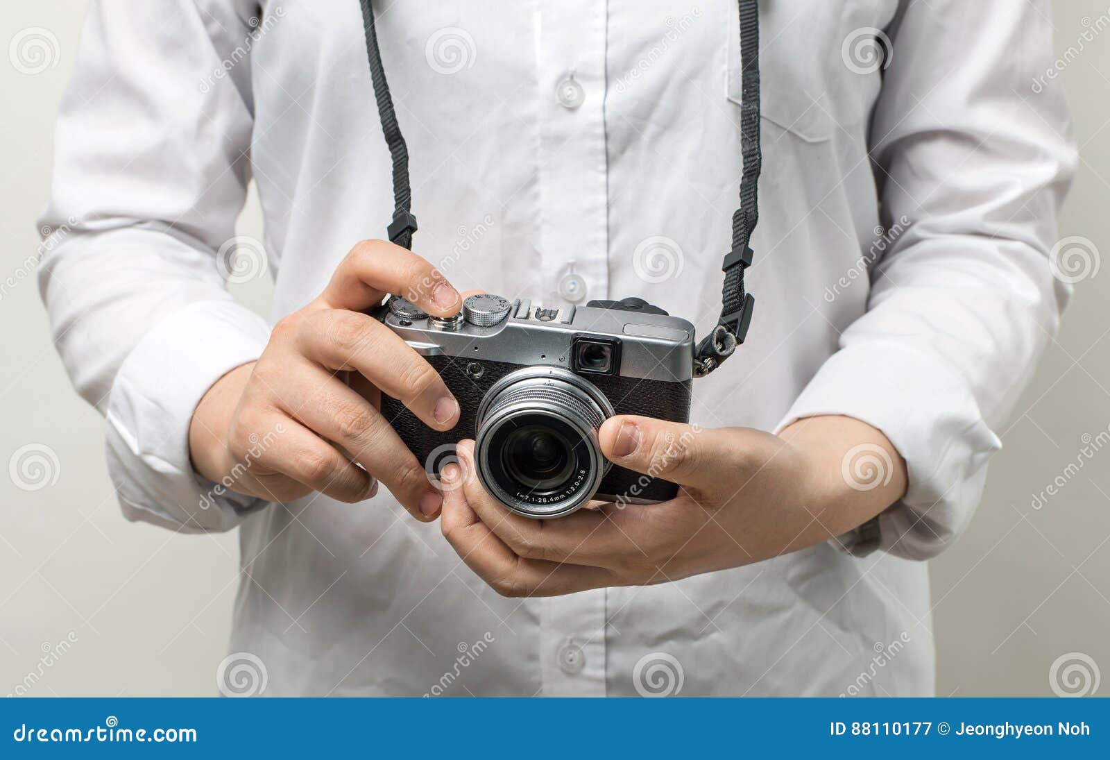 Female Hand Holding Modern Camera Mirrorless Camera. Stock Image ...