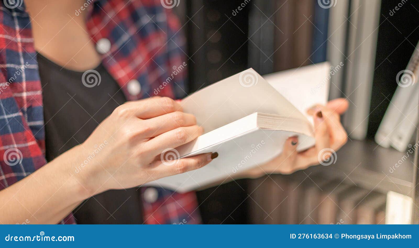 Female Hand Holding Notebook and Reading Book with the Space Area for ...