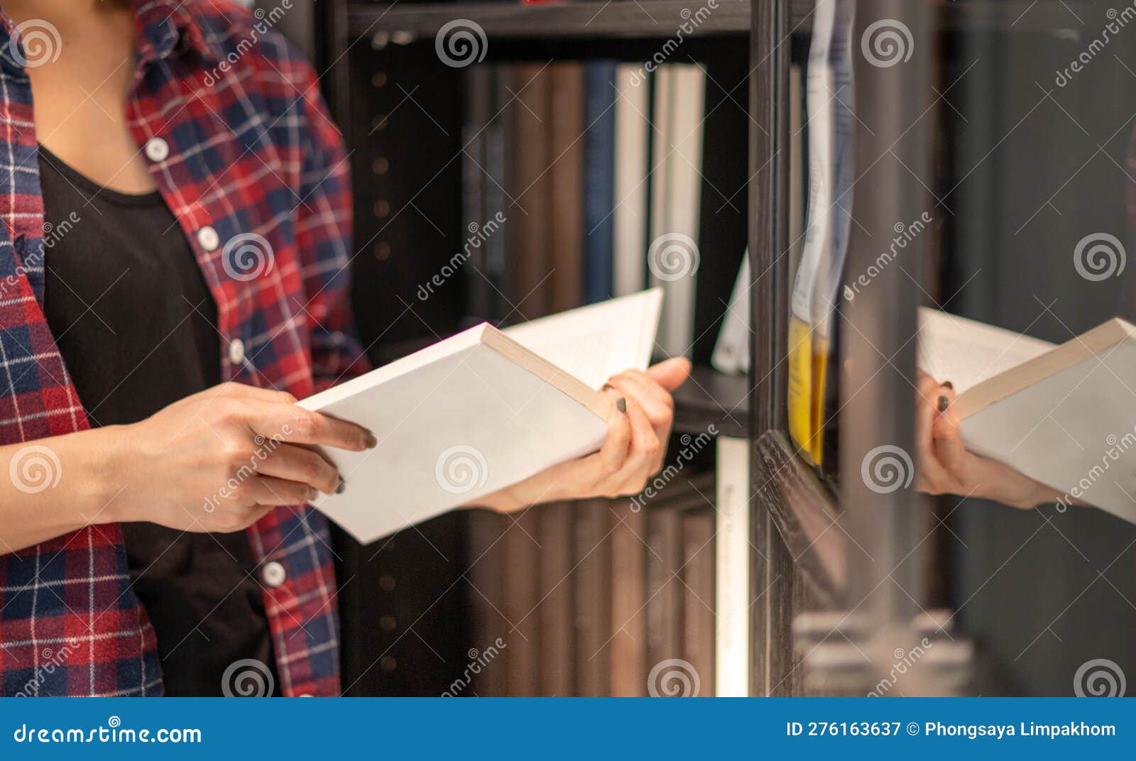 Female Hand Holding Notebook and Reading Book with the Space Area for ...