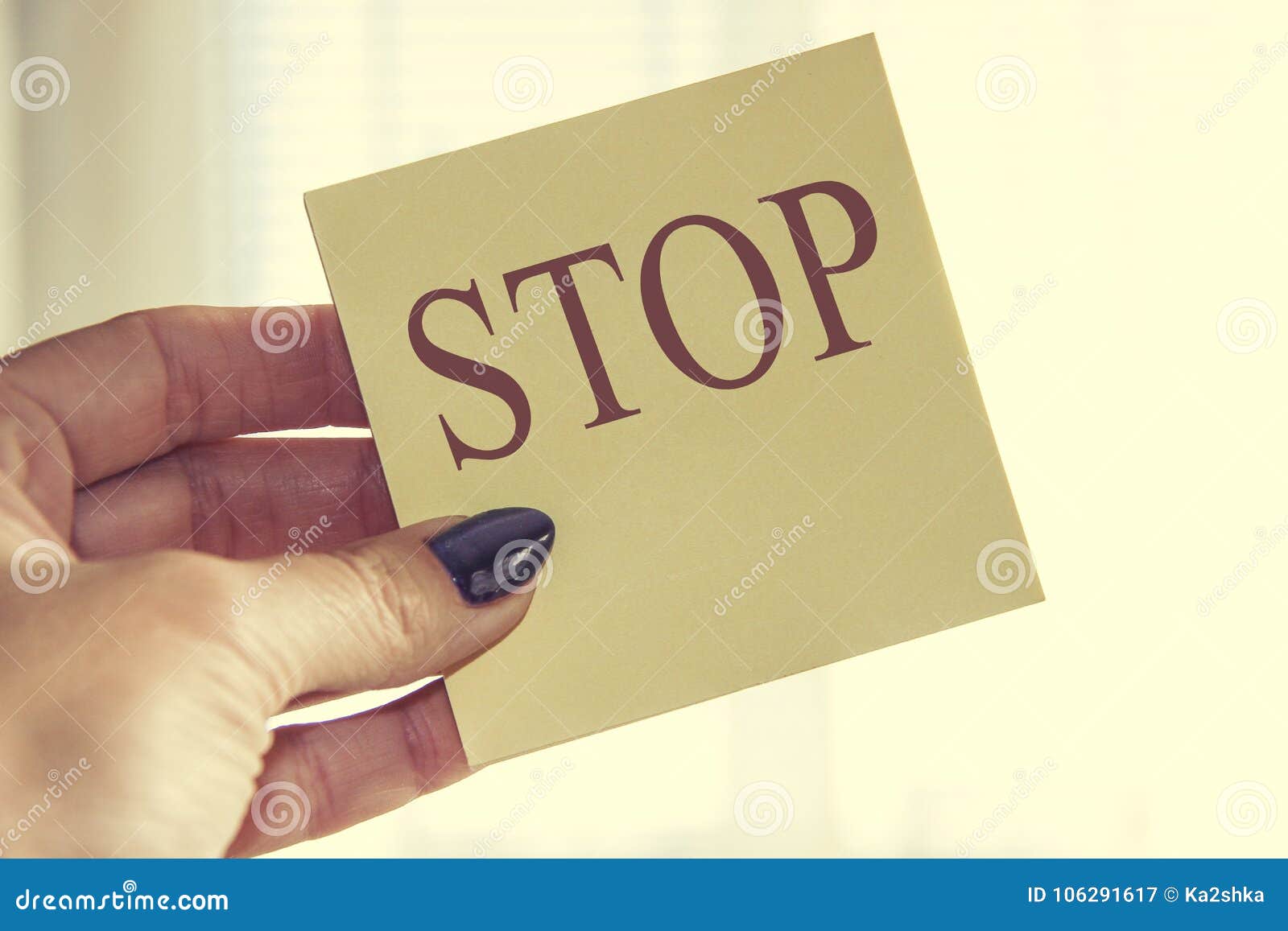 Female Hand Holding Paper with Stop Letter. Stock Image - Image of ...