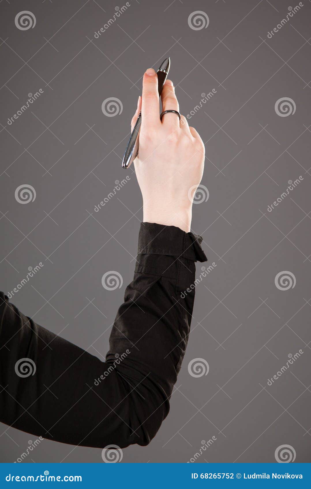 Female hand holding a pen stock photo. Image of holding - 68265752