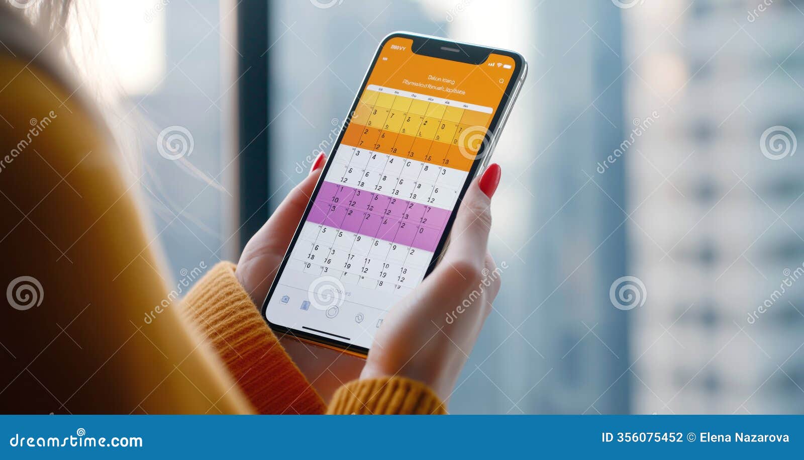 Female Hand Holding Smartphone with Color-coded Calendar App Display ...
