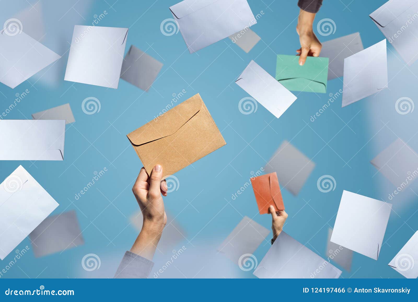 An Envelope on a Blue Background Stock Photo - Image of holding, card ...