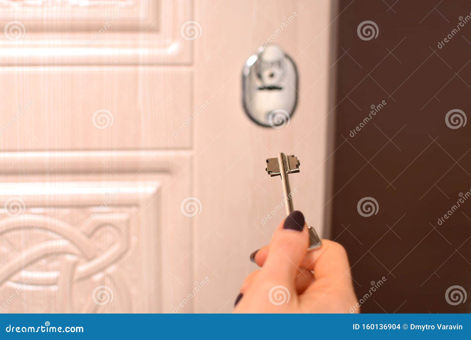Female Hand with the Key To the Keyhole from the Front Door Stock Photo ...