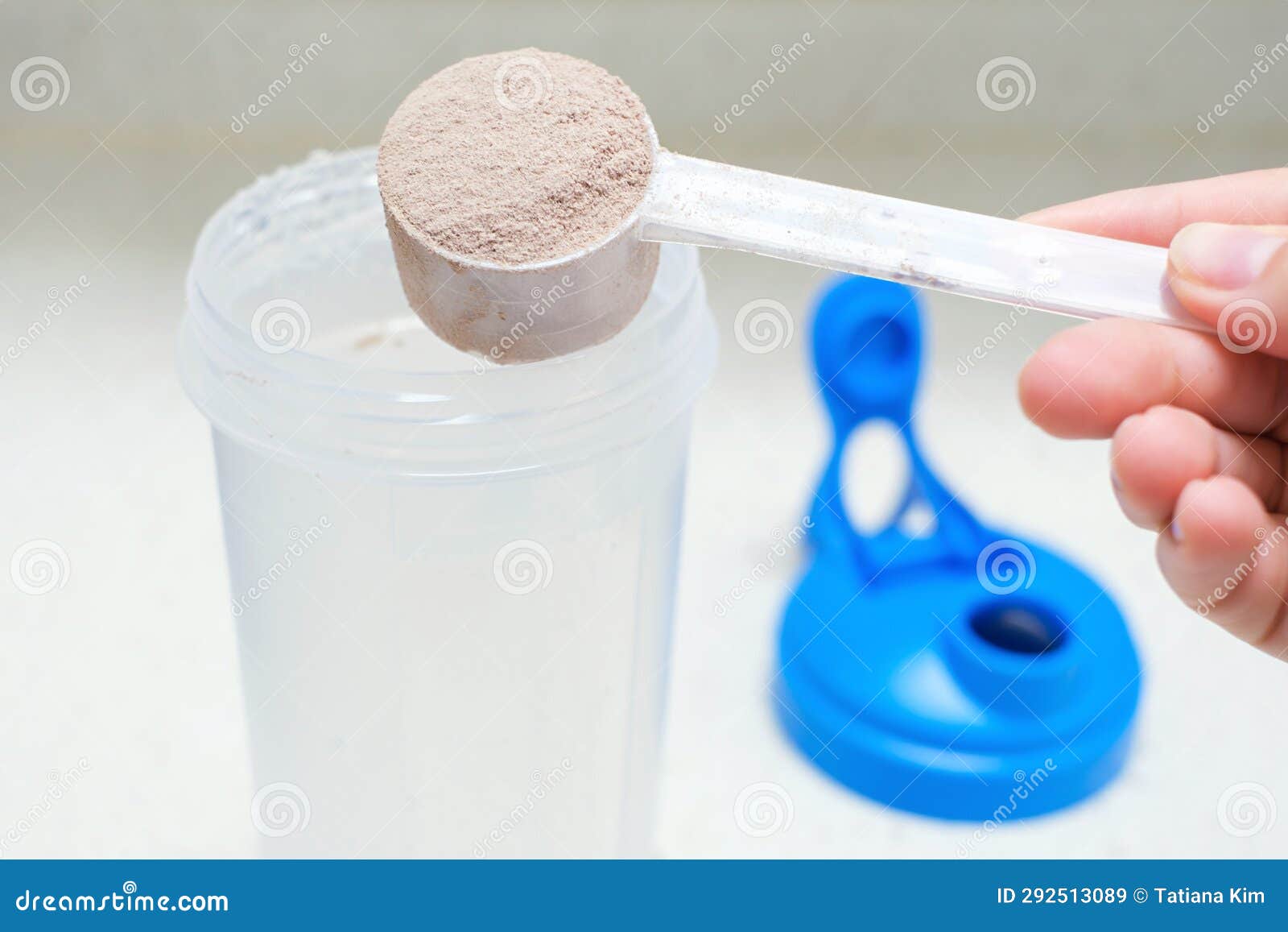 Female Hand Making Chocolate Protein Shake Side View. Stock Image ...
