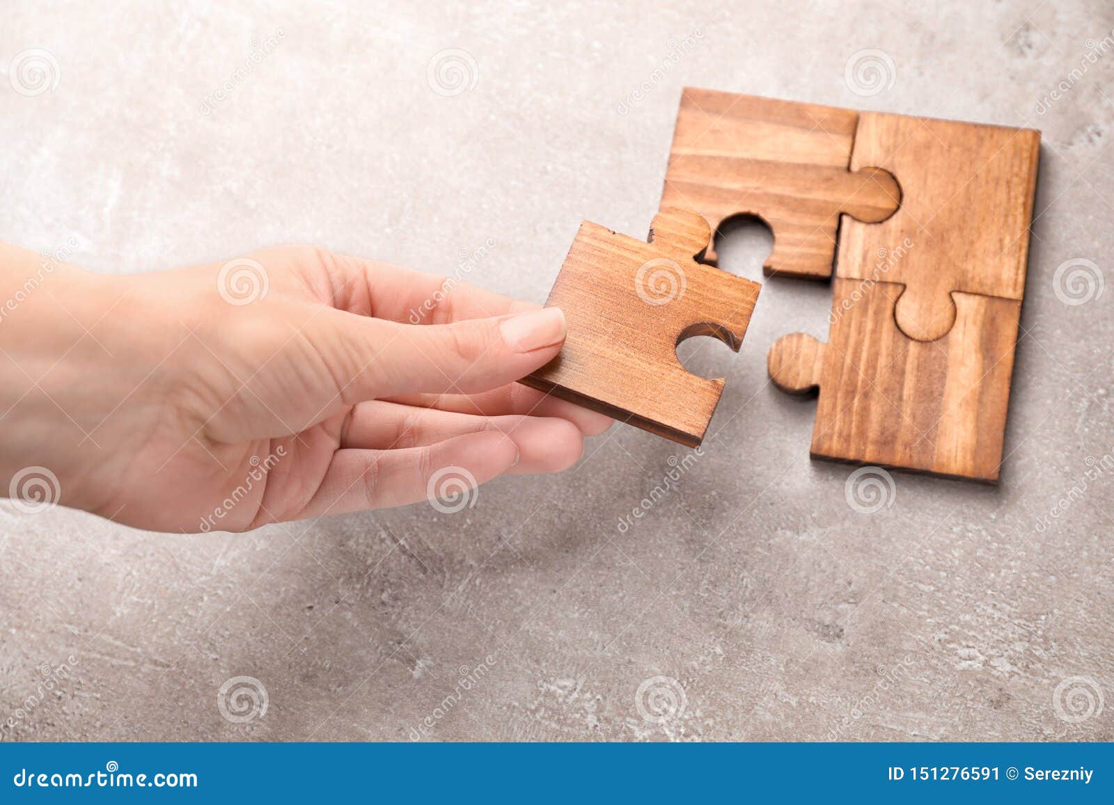 Female Hand with Pieces of Puzzle on Grey Background Stock Image ...