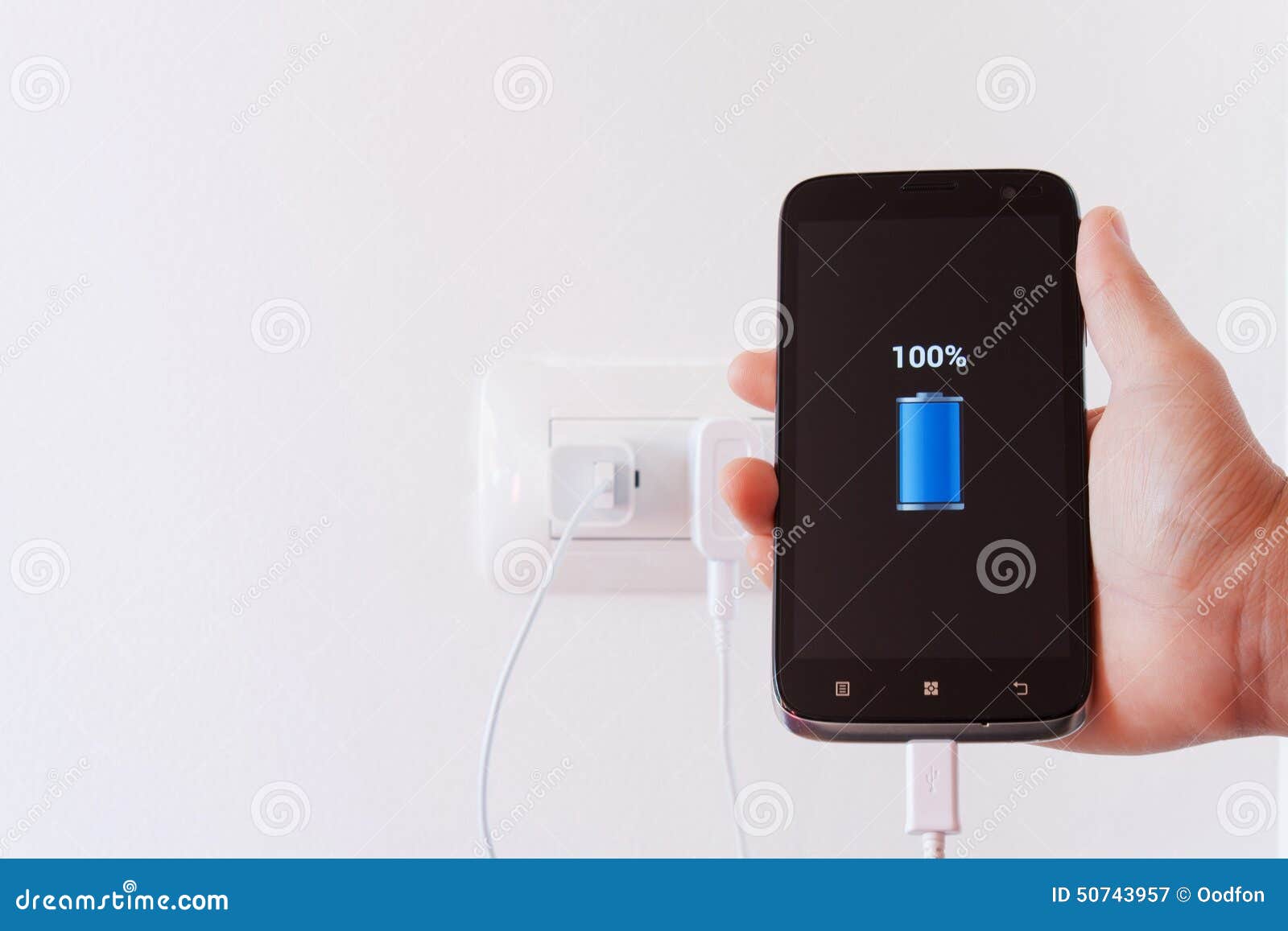 Female Hand Plugging in the Plug of Her Smartphone in a Socket Stock ...