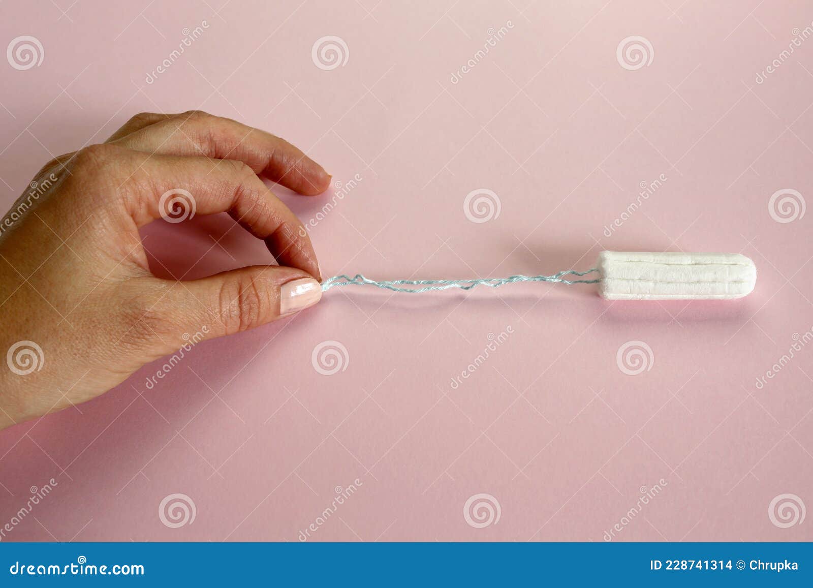 Female Hand Pulls the String of the Clean Cotton Tampon Stock Photo ...