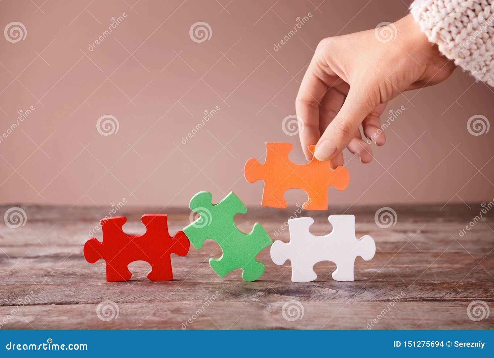 Female Hand Putting Pieces of Puzzle on Table Stock Photo - Image of ...