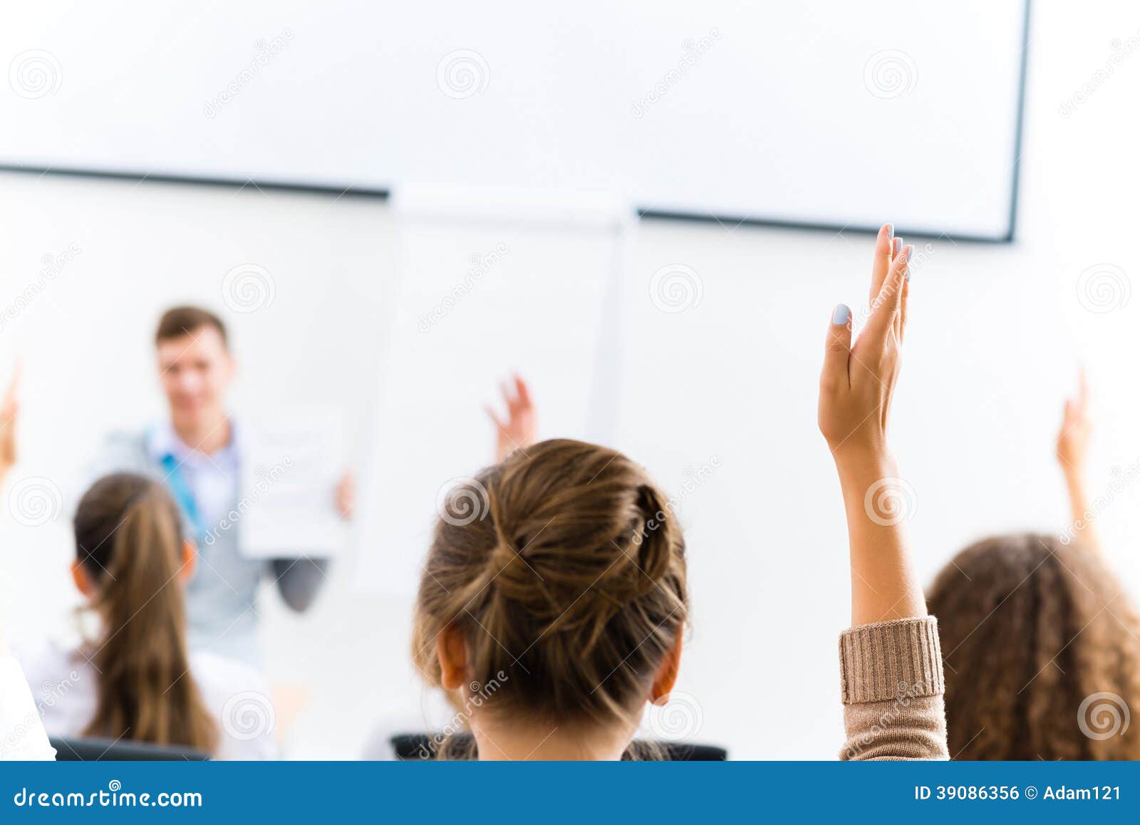 Female Hand Raised in Class Stock Photo - Image of casual, hand: 39086356