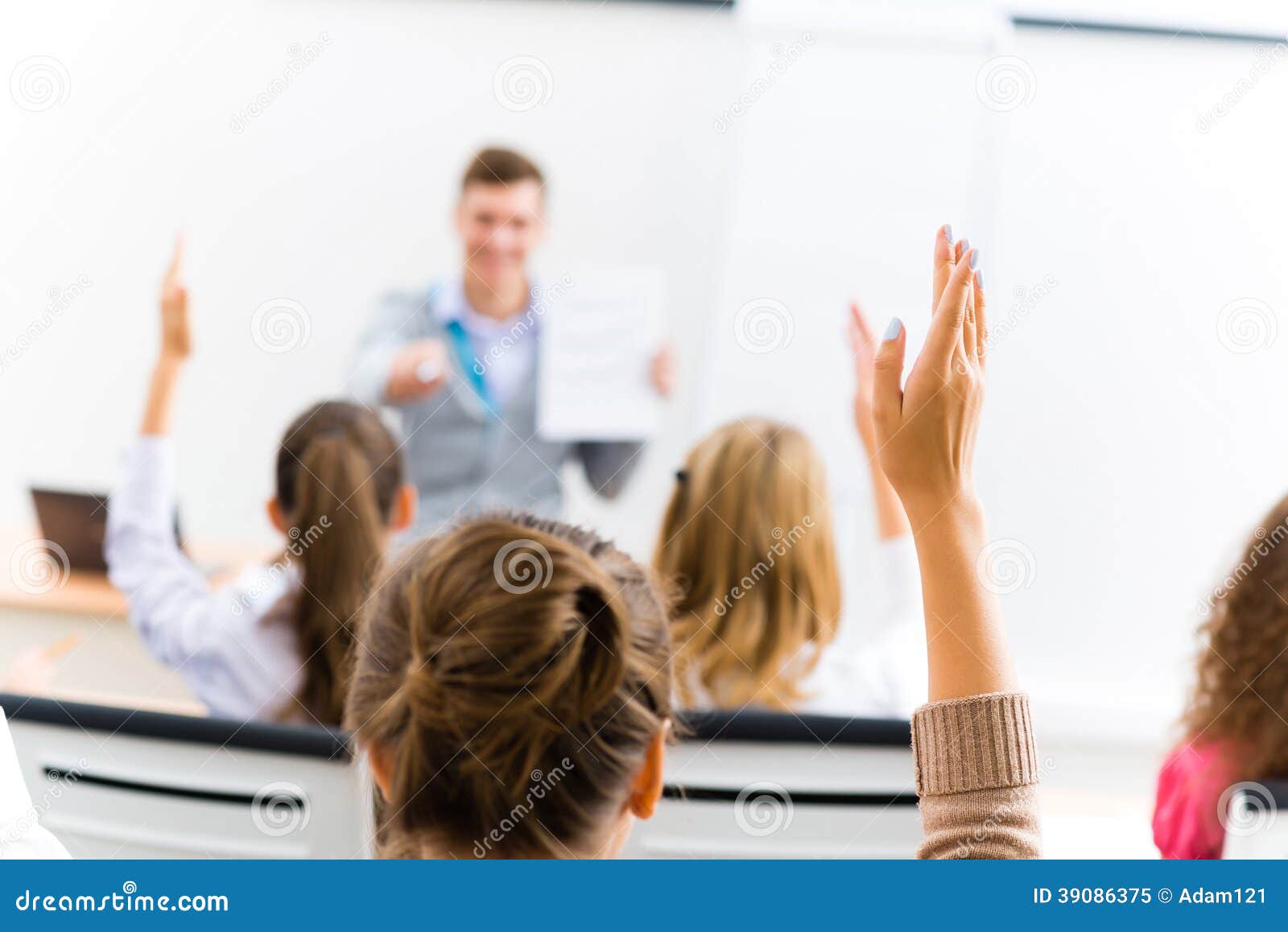 Female Hand Raised in Class Stock Image - Image of adult, group: 39086375