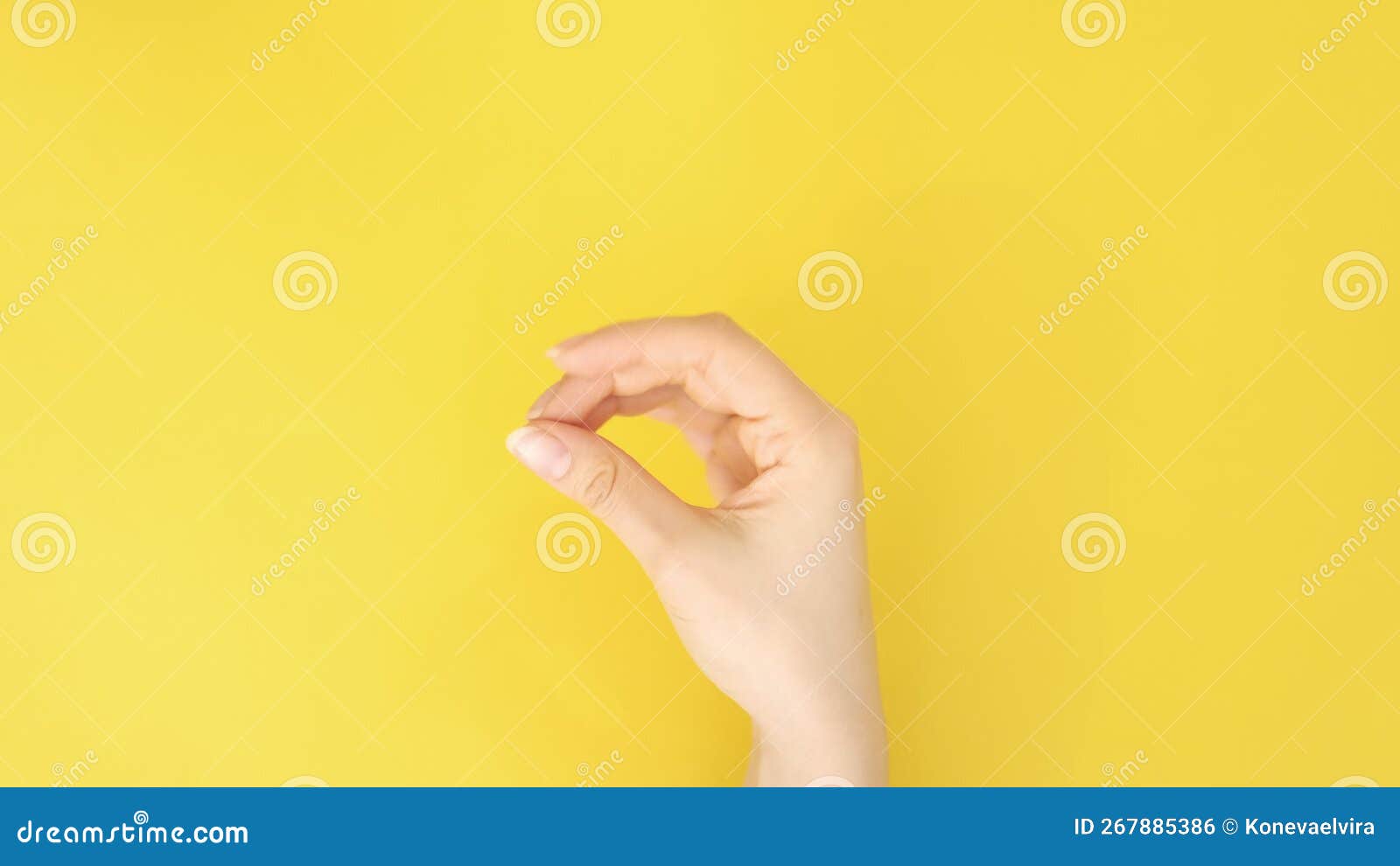 Female Hand Raising, with Finger Snapping Gesture on a Yellow ...