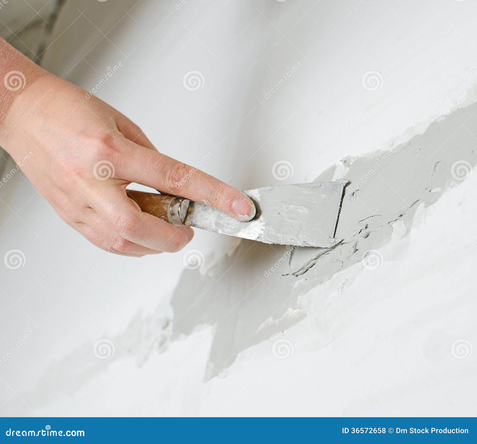 Female hand repairs wall stock photo. Image of craft - 36572658