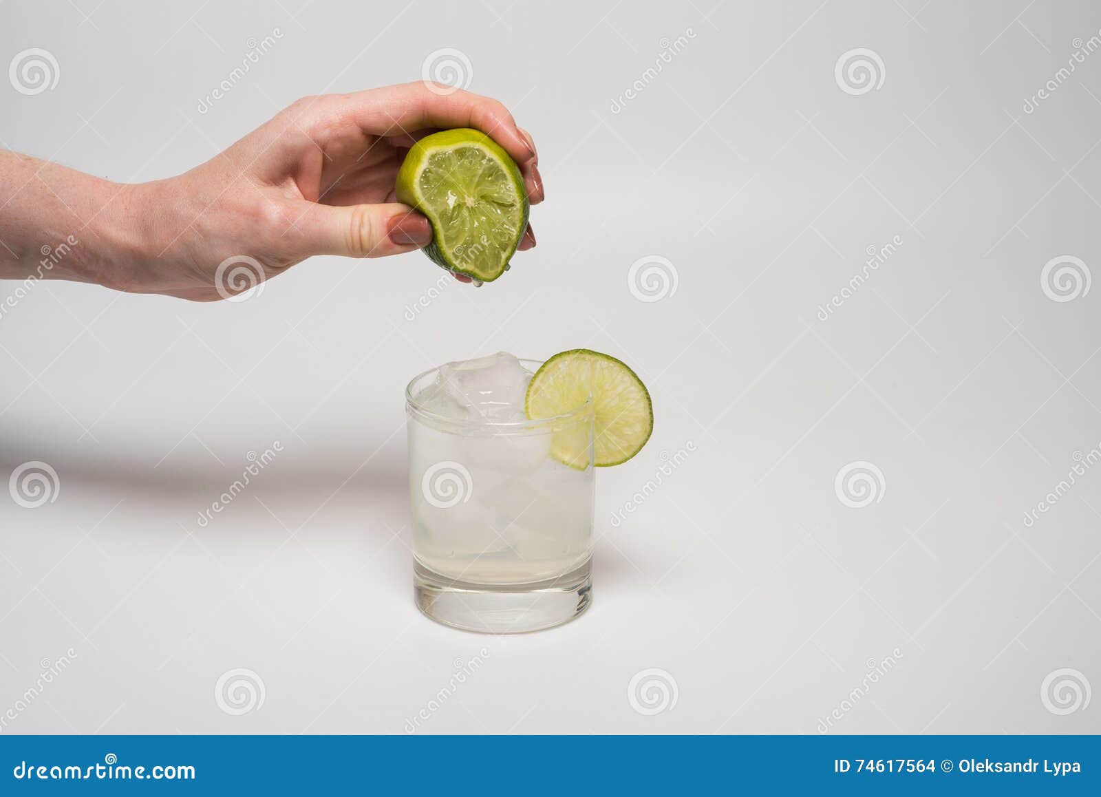 Female hand squeezing lime stock photo. Image of cocktail - 74617564