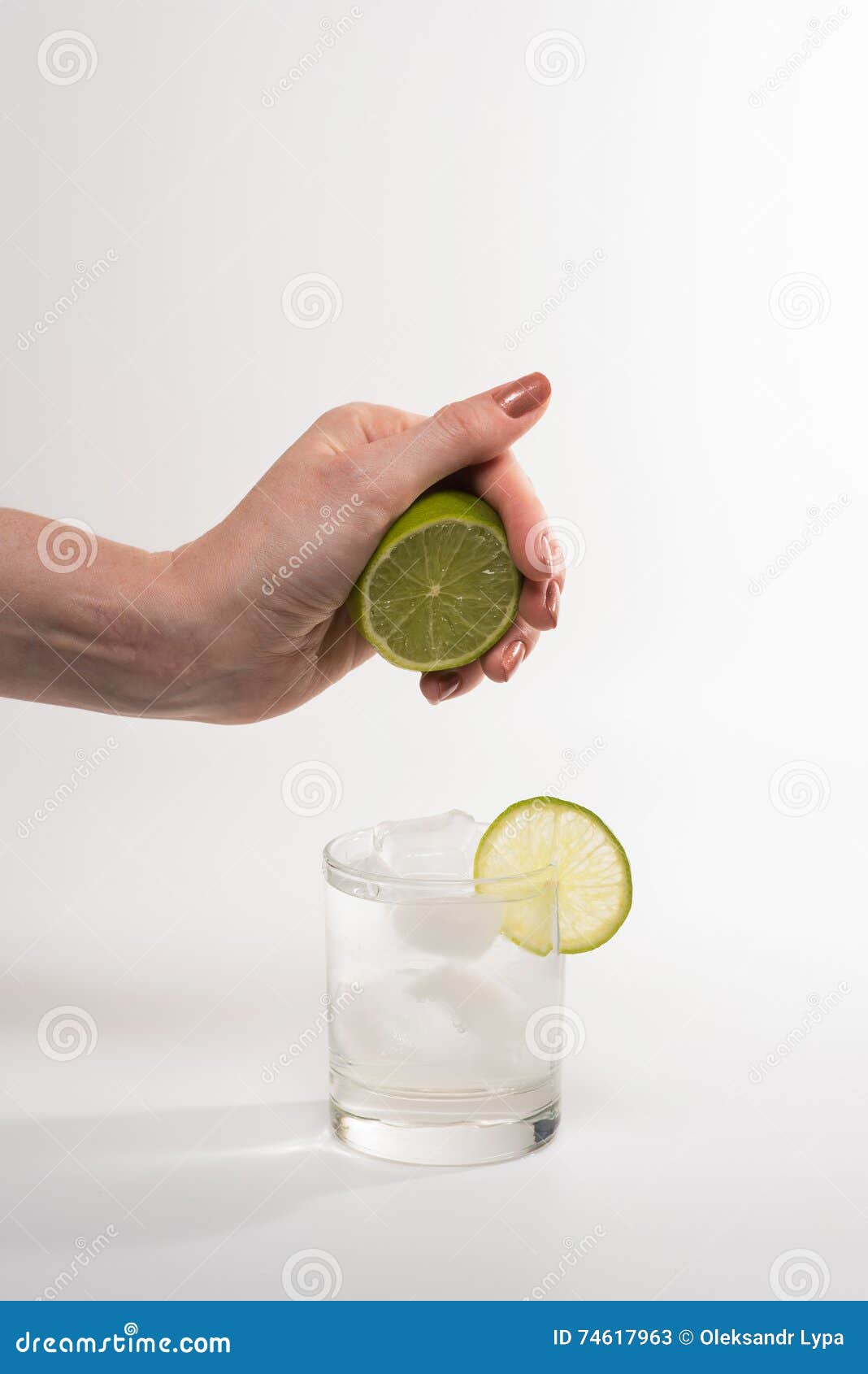 Female hand squeezing lime stock image. Image of fruit - 74617963