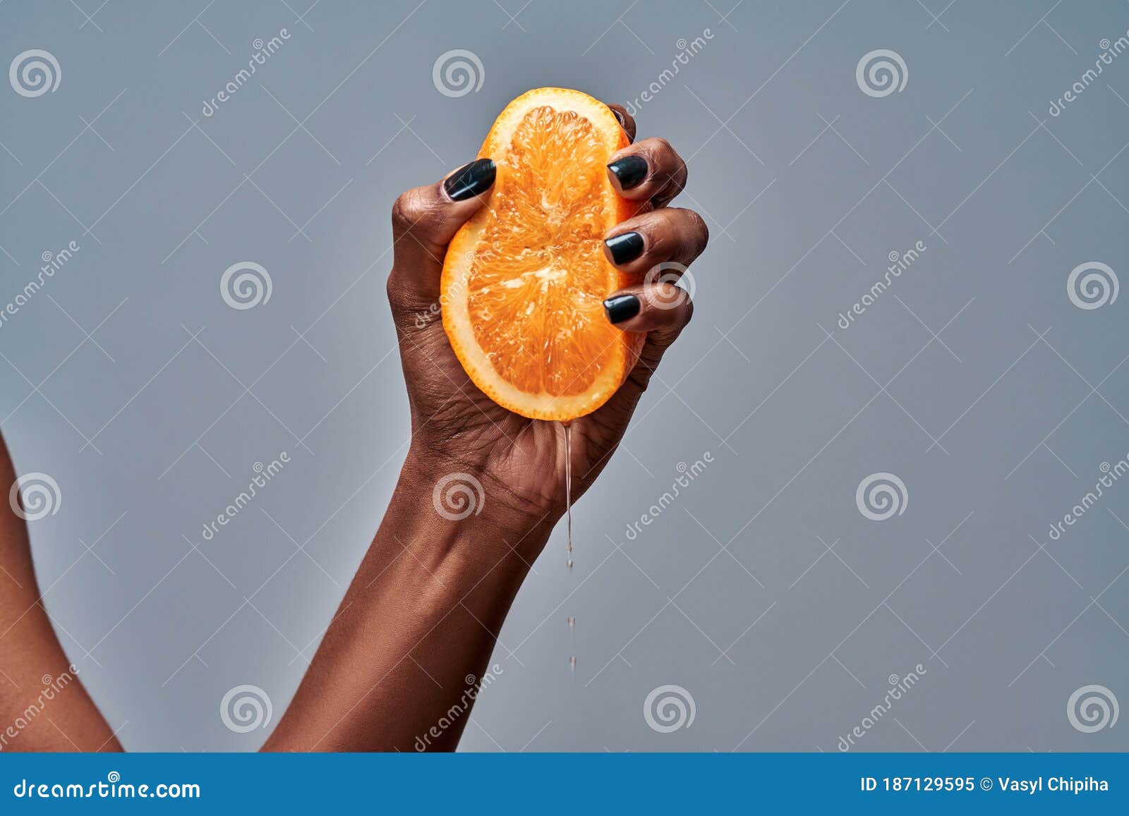 Female Hand Squeezing Orange Isolated on Grey Stock Image - Image of ...