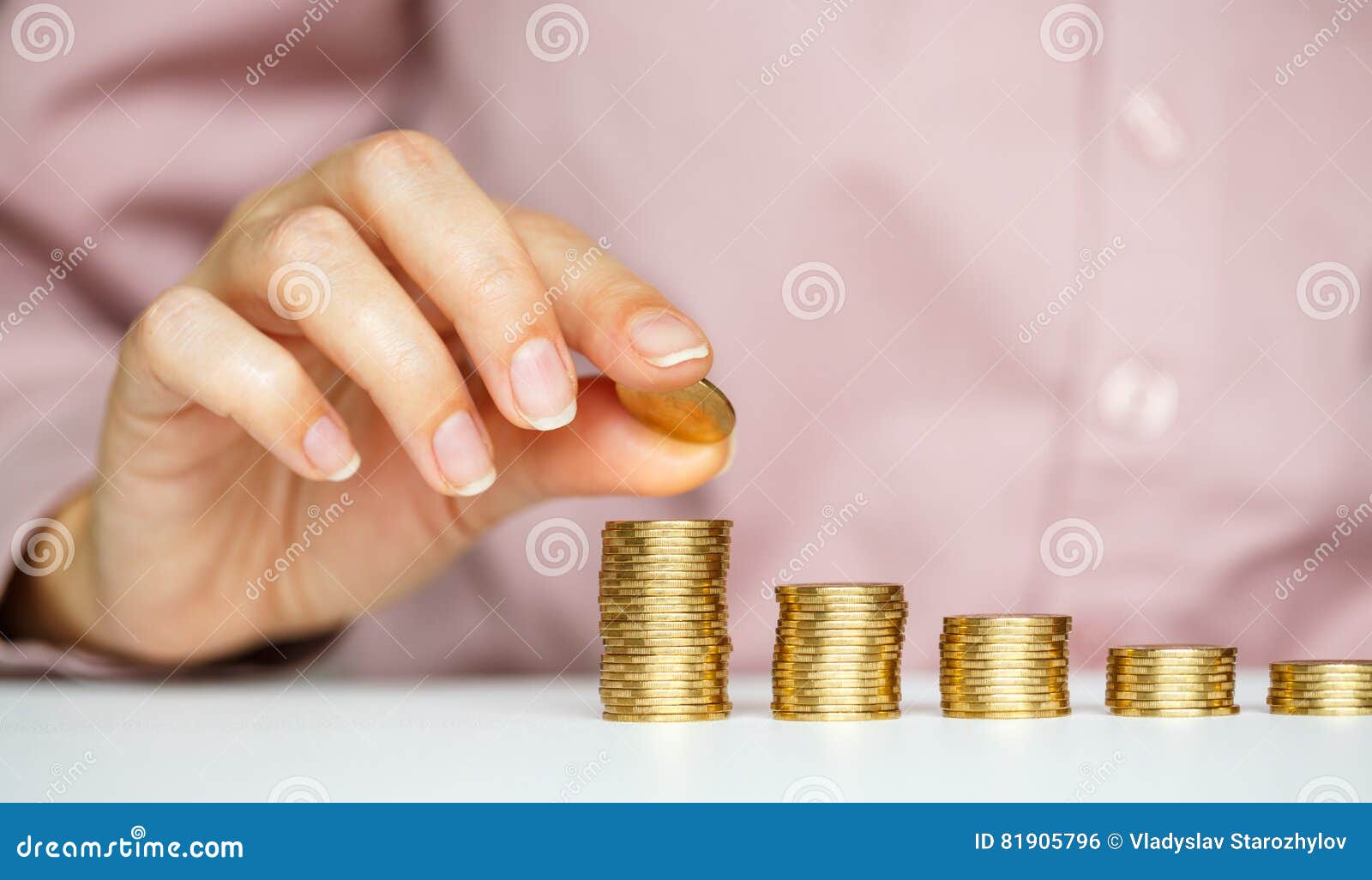 Female Hand Stacking Gold Coins into Increasing Columns Stock Photo ...
