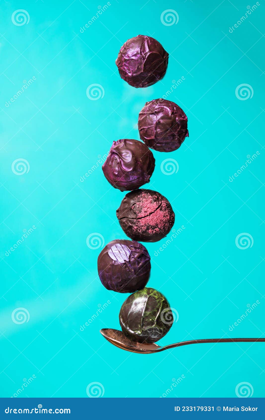 Female Hand Throwing Bright Multi-colored Round Candies into Air ...