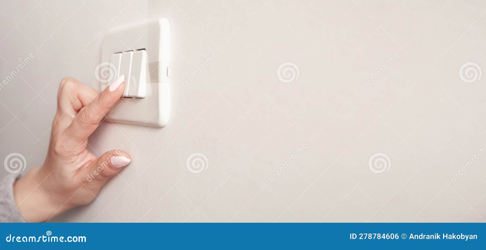 Female Hand Turning an Electricity Light Switch on the Wall Stock Photo ...