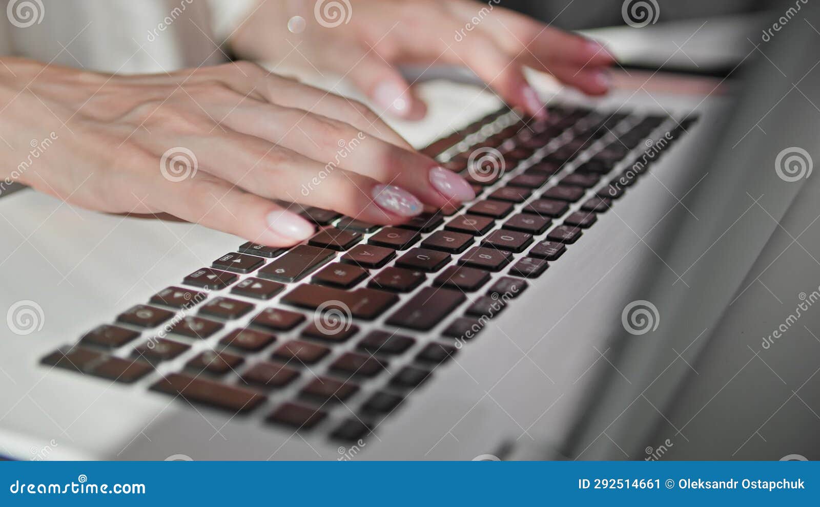 Female Hand Typing on Keyboard of a Laptop Computer Sitting at Table ...