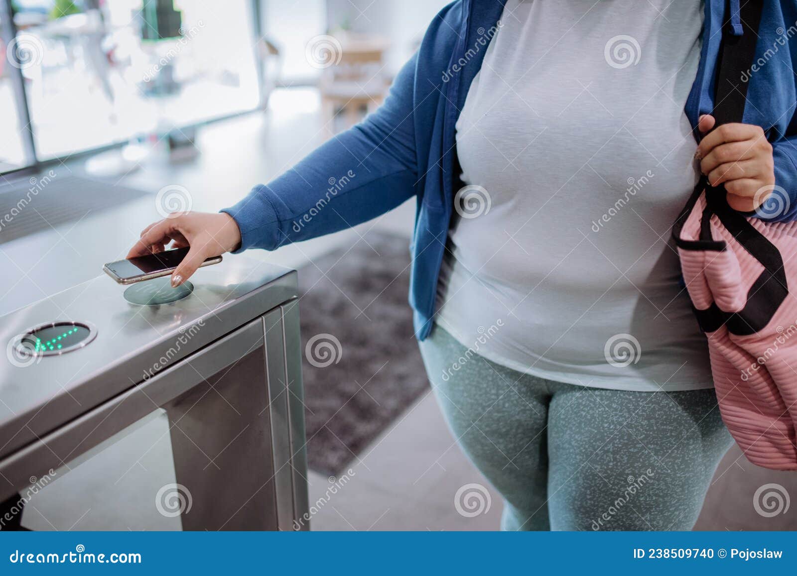 Female Hand Using Smartphone To Open Automatic Gate Machine in Gym ...