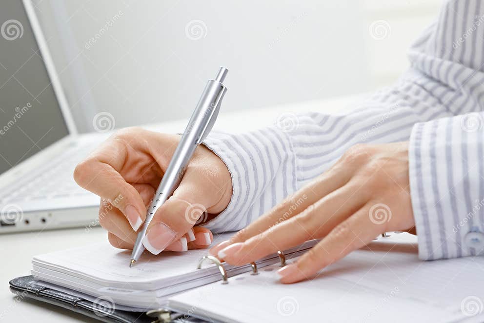 Female hand writing notes stock photo. Image of laptop - 11267110