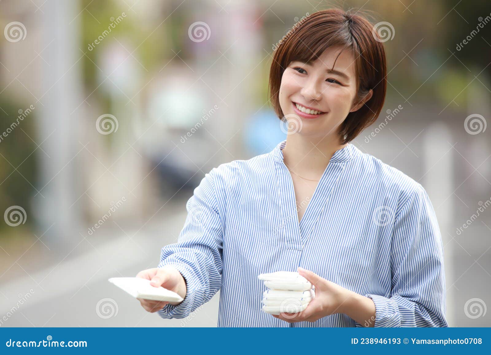 Female handing out tissue stock image. Image of woman - 238946193
