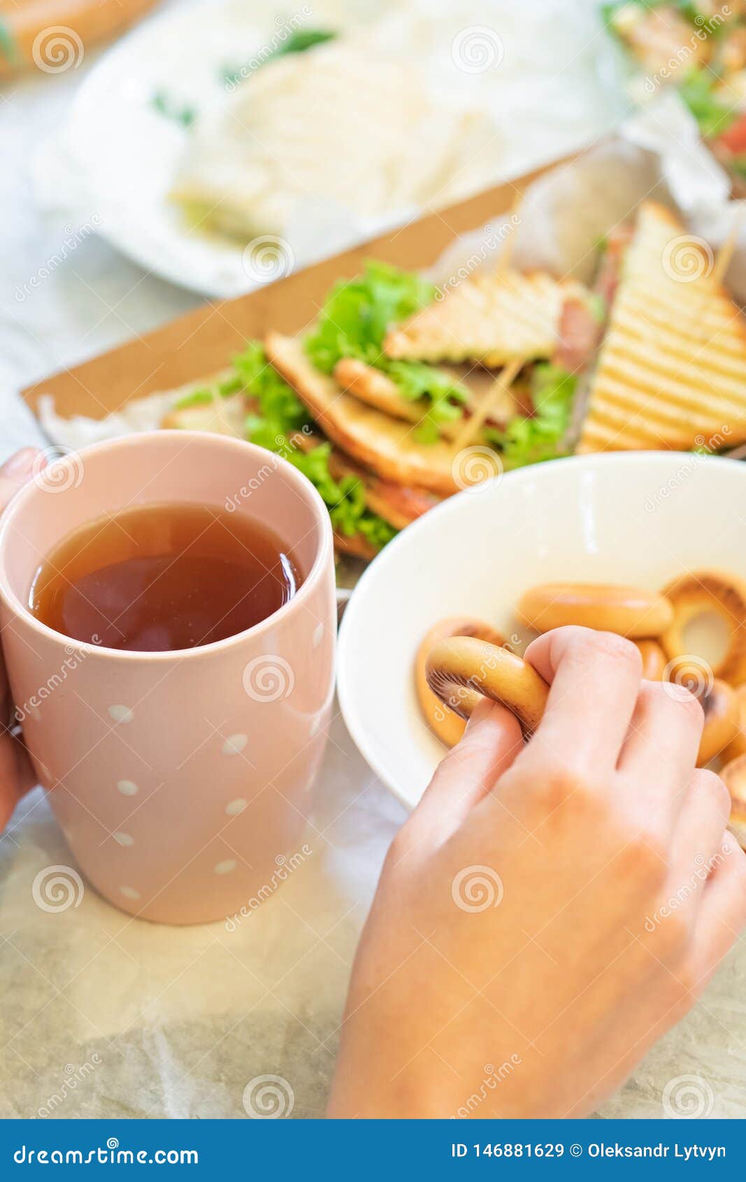 Female Hands with a Cup of Tea and Bagels Stock Image - Image of table ...