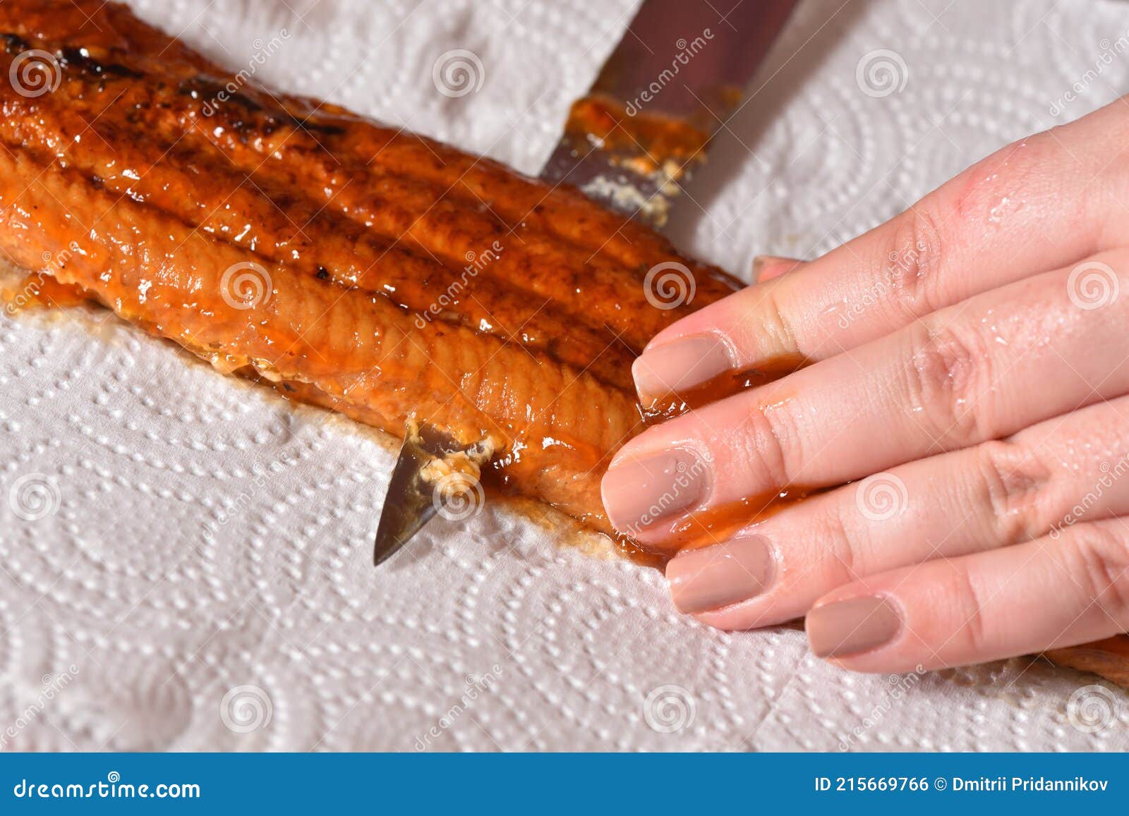 Female hands cut eel fish stock photo. Image of seafood - 215669766