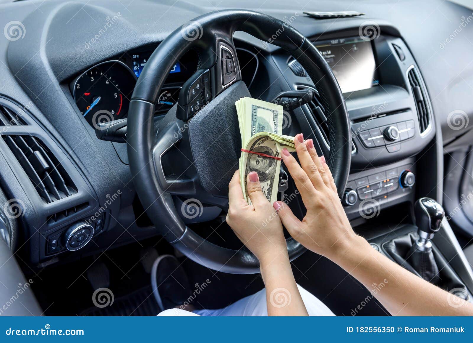 Female Hands with Dollar Bundle on Steering Wheel Close Up. Bribery and ...