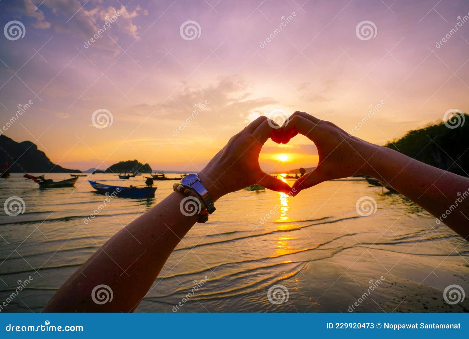 Female Hands in the Form of Heart in Sunset Sky at the Sea Stock Image ...