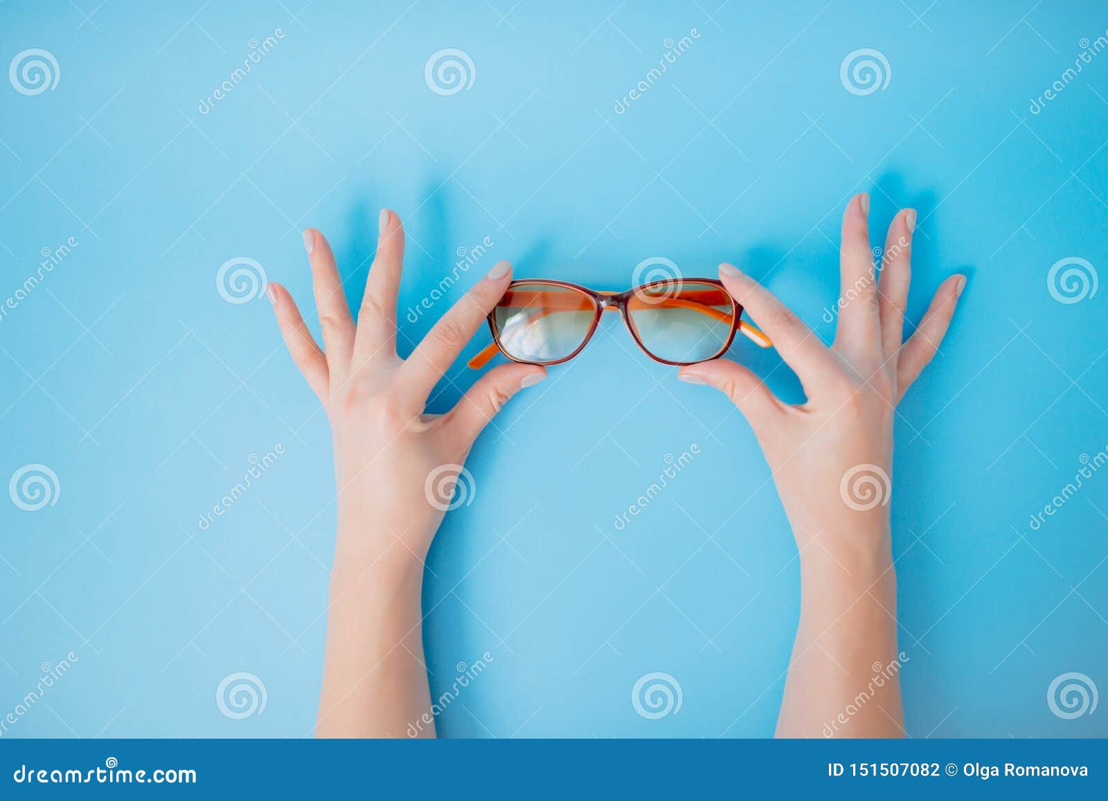 Hands Holding Glasses on Blue Background. Stock Photo - Image of ...