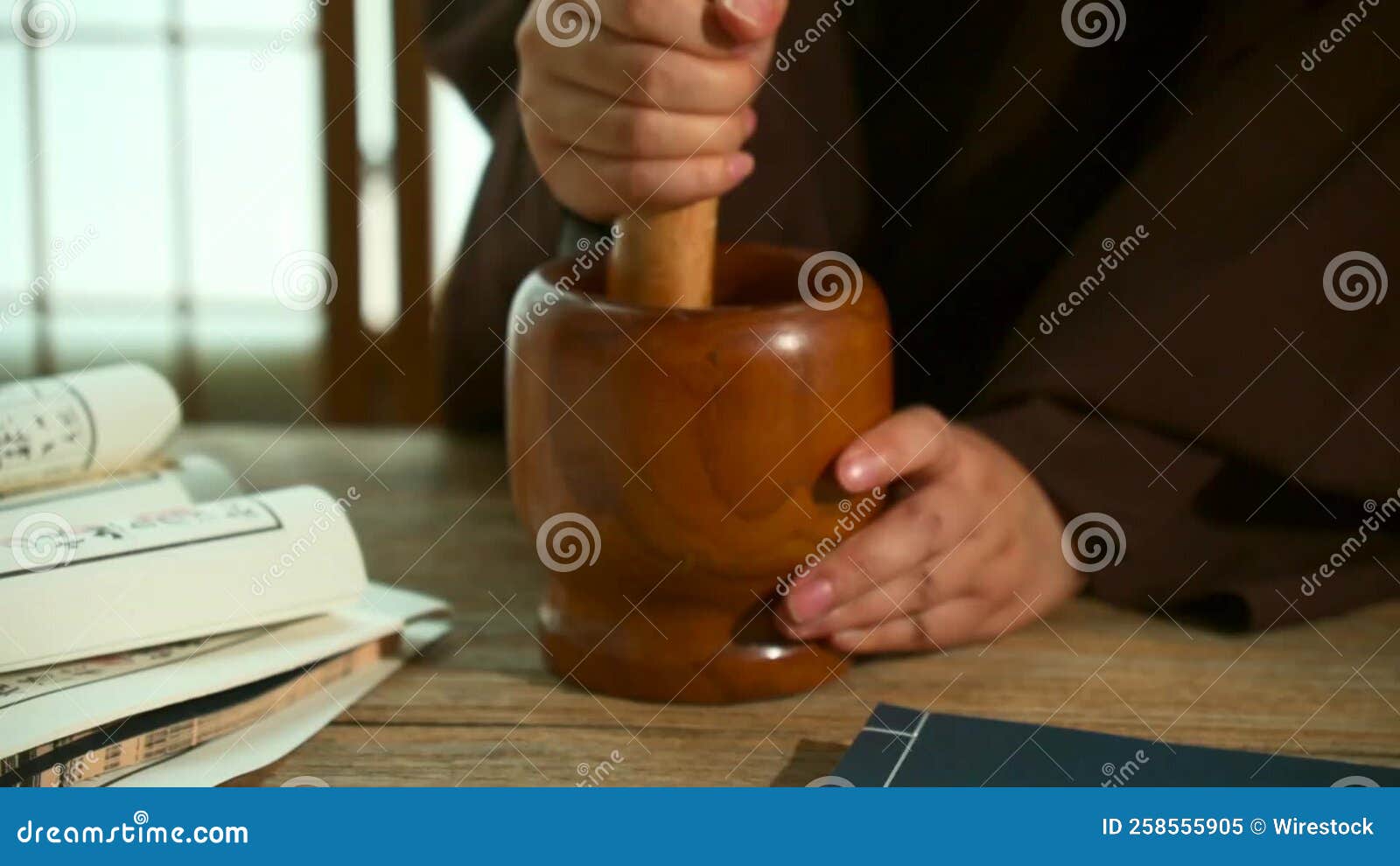 Female Hands Grind Using Wooden Mortar and Pestle on the Table Stock ...