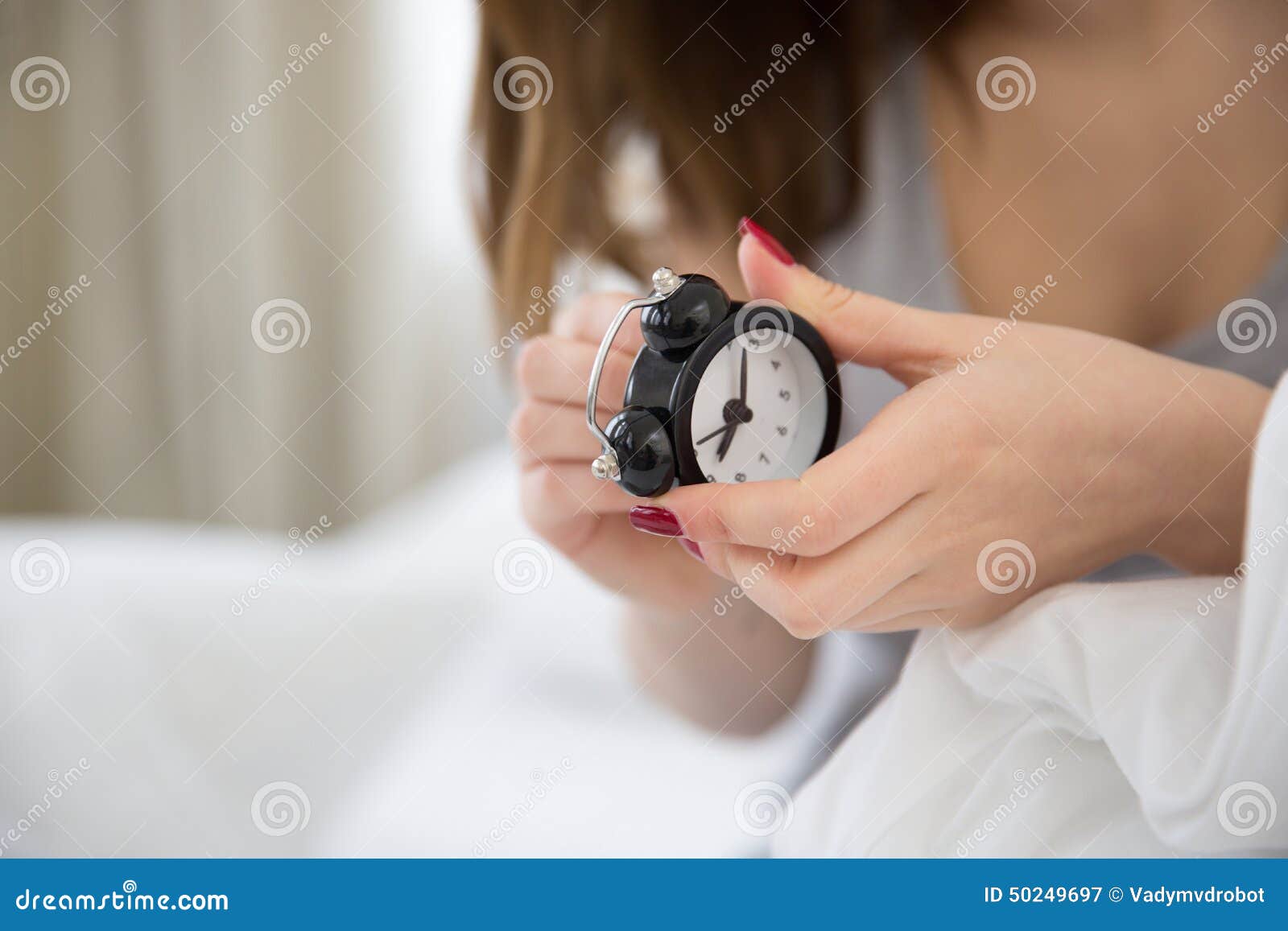 Female Hands Holding Alarm Clock Stock Image - Image of hands, clock ...