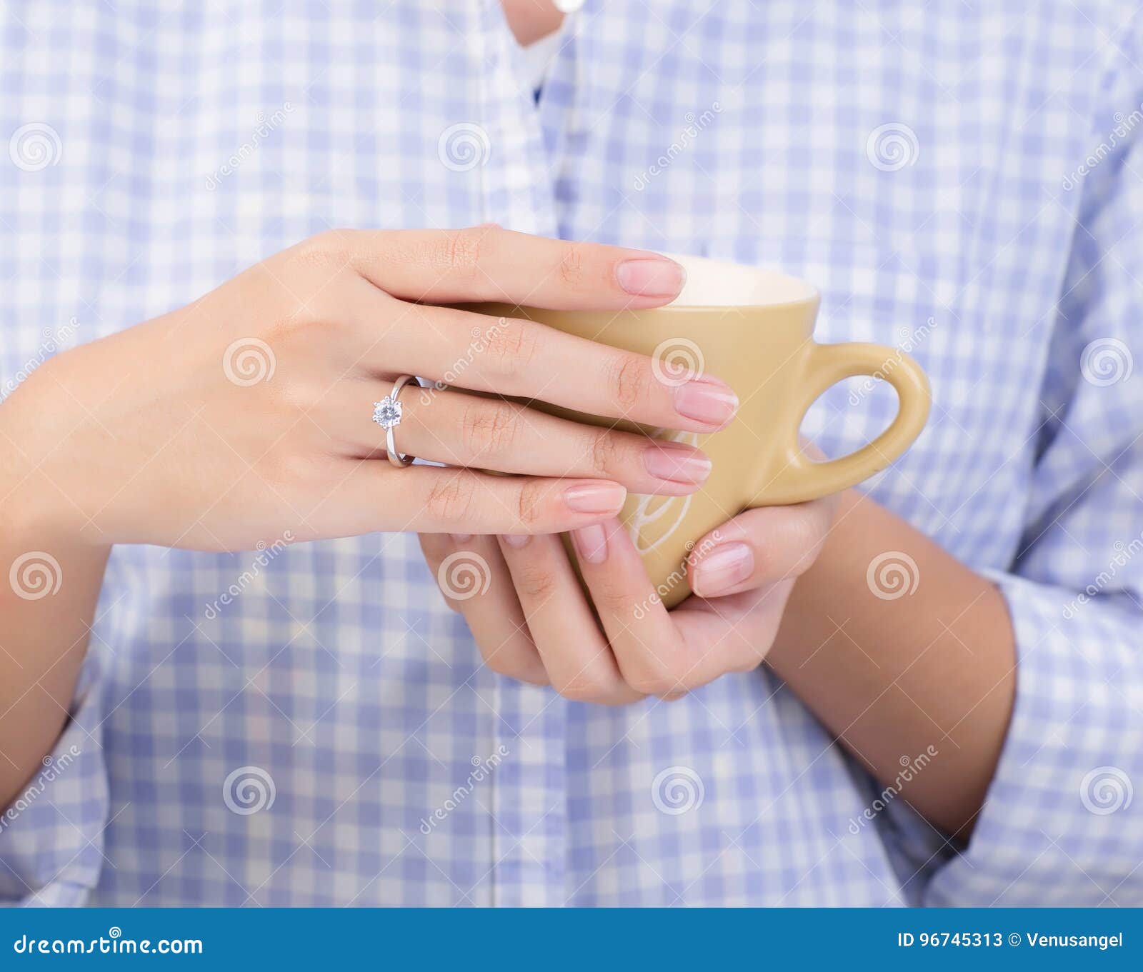 Female hands holding a cup stock image. Image of closeup - 96745313