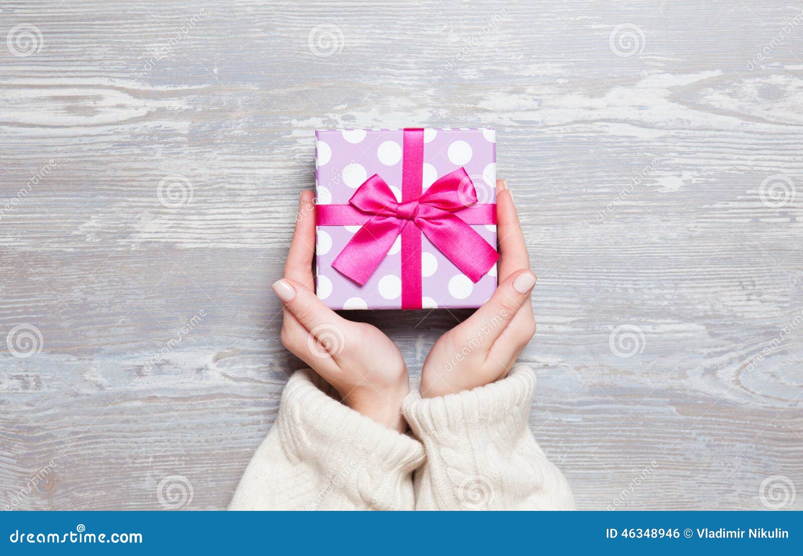 Female hands holding gift stock photo. Image of cover - 46348946