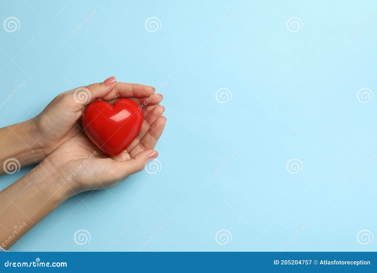 Female Hands Holding Heart on Blue Background, Space for Text Stock ...